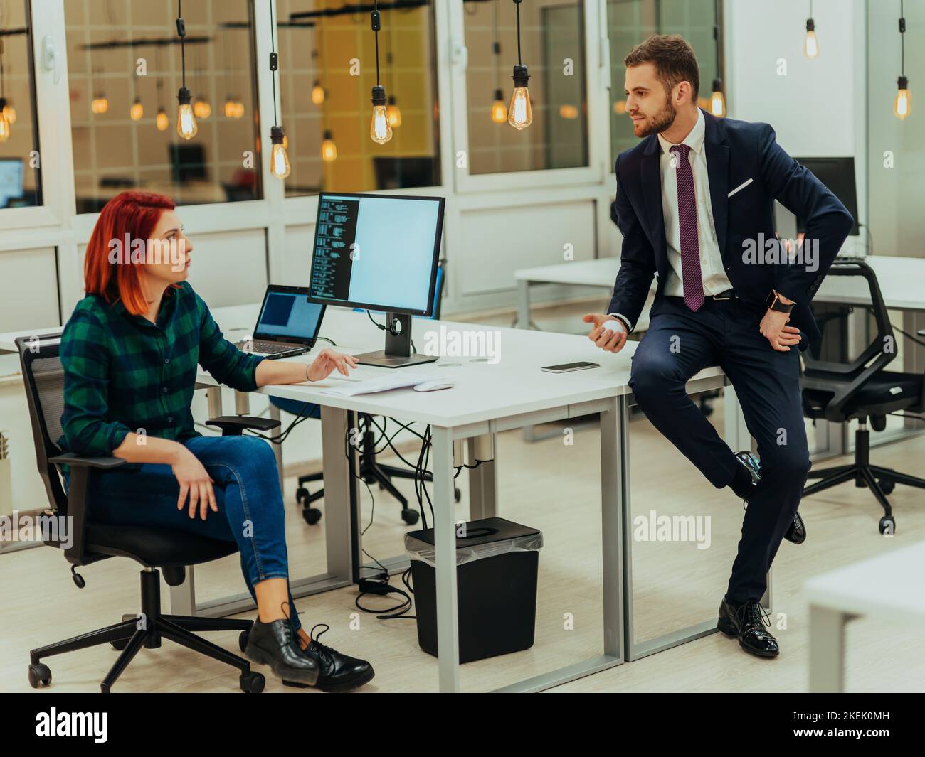 Two Creative office workers collaborate together to discuss main ideas ...