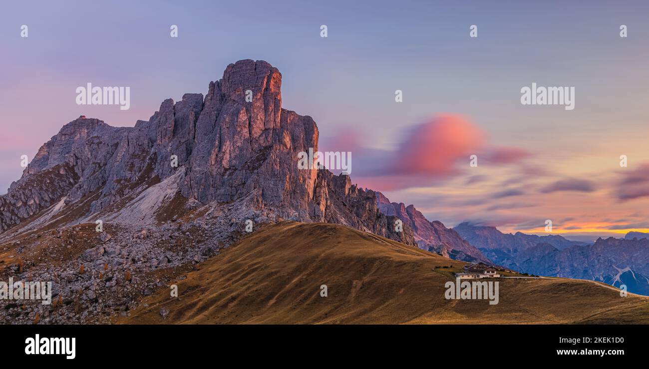 It is autumn in the Dolomites and a beautiful sunrise on the Giau Pass ...