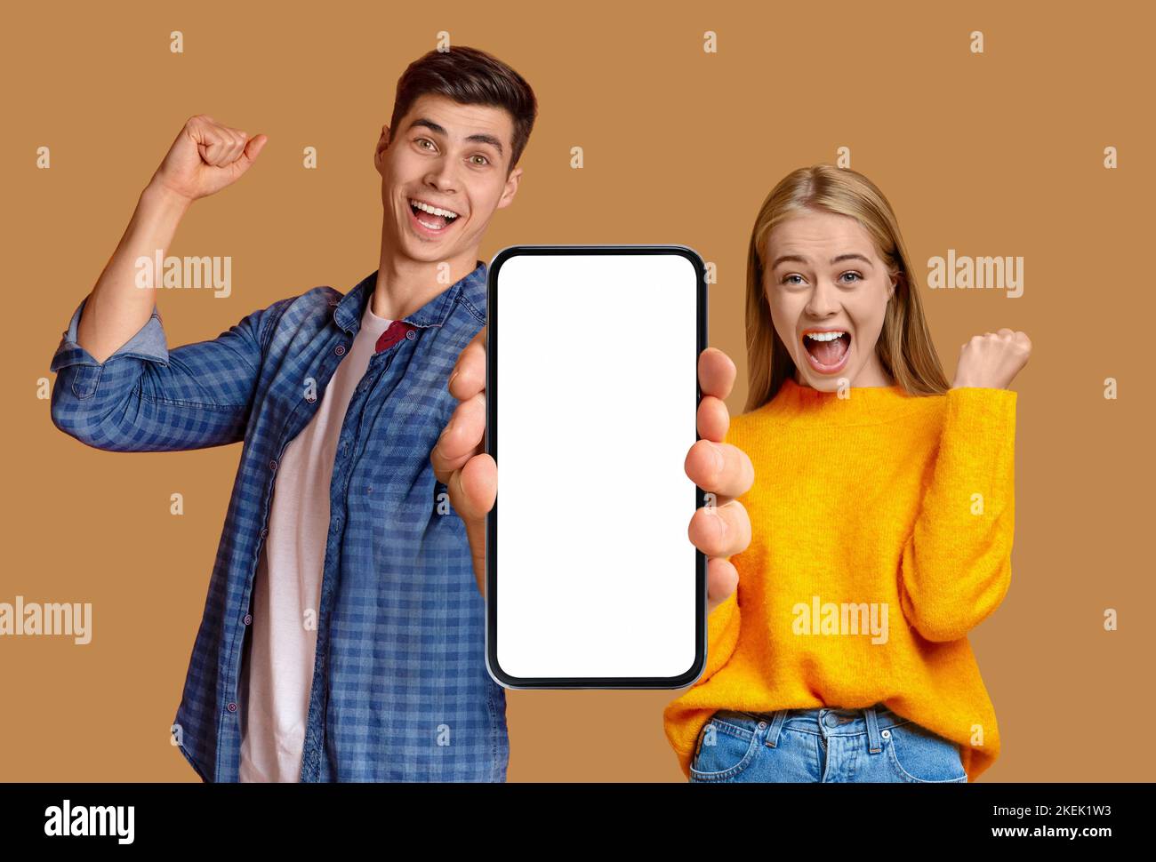 Satisfied emotional young caucasian guy and lady with open mouth enjoy ...