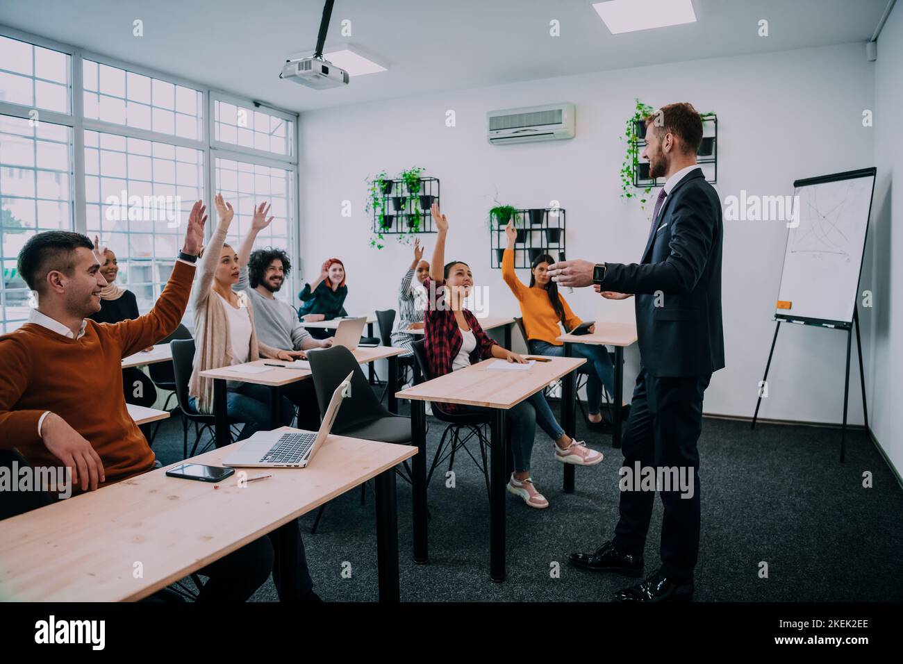 Group of young diverse people gathered together having a work ...