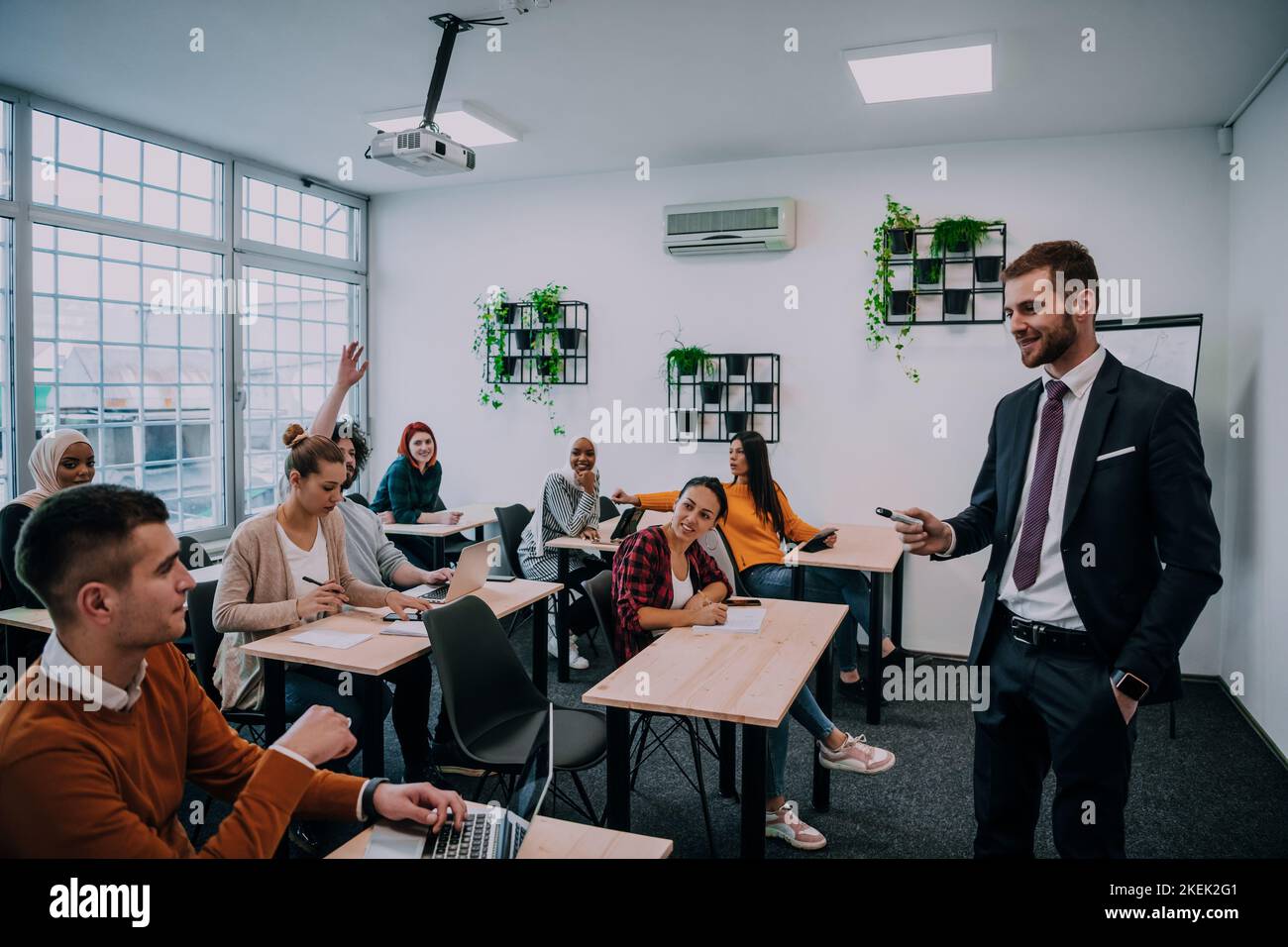 Group of young diverse people gathered together having a work ...