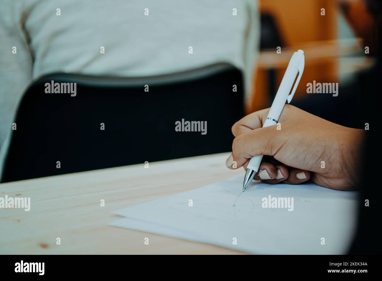 Businesswoman makes a note in notebook Stock Photo - Alamy