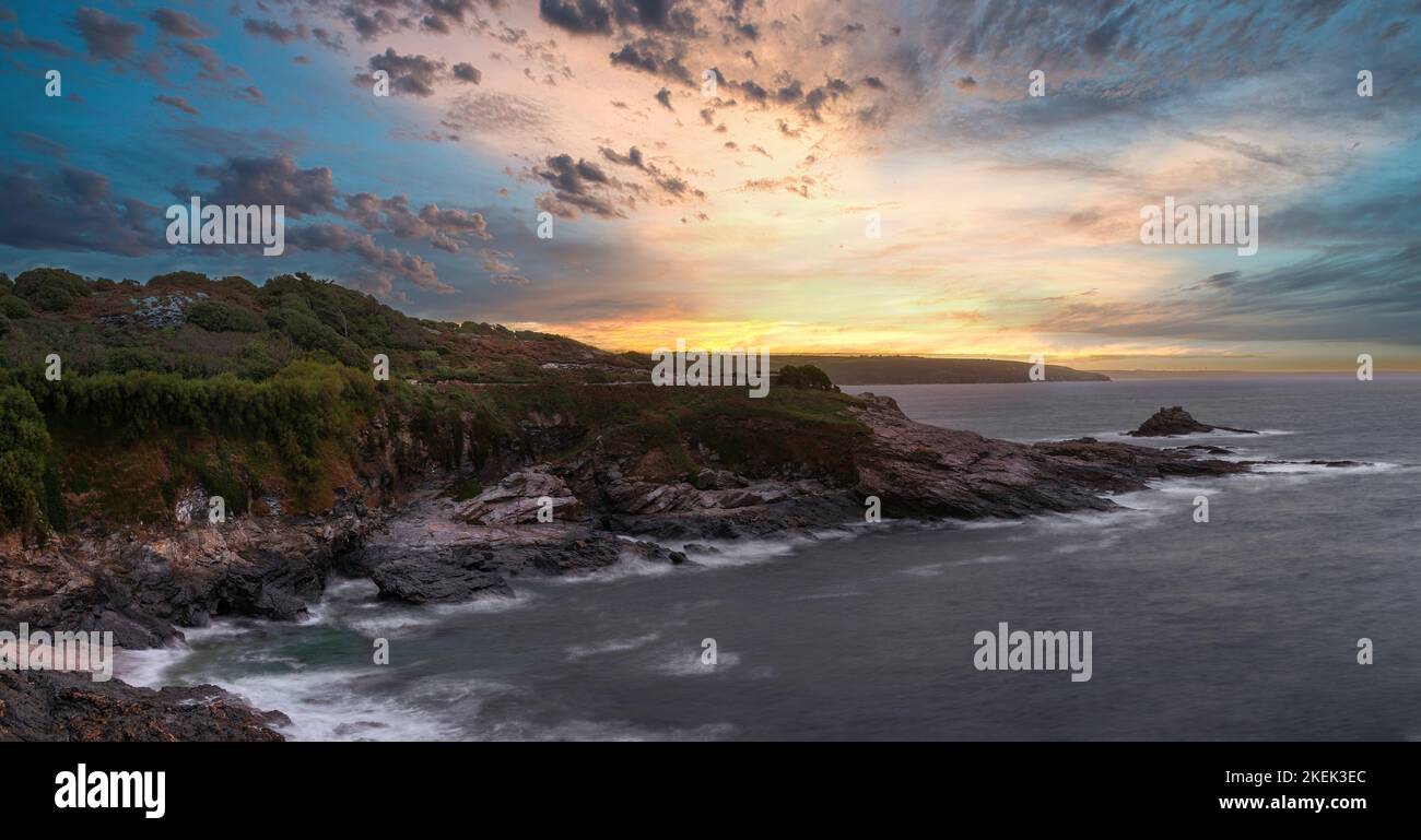 Moody landscape sunrise image at Prussia Cove in Cornwall England with ...