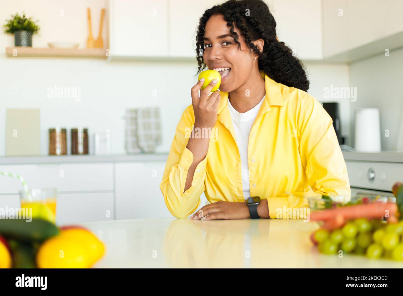 Healthy dieting and lifestyle. Young african american woman holding and ...