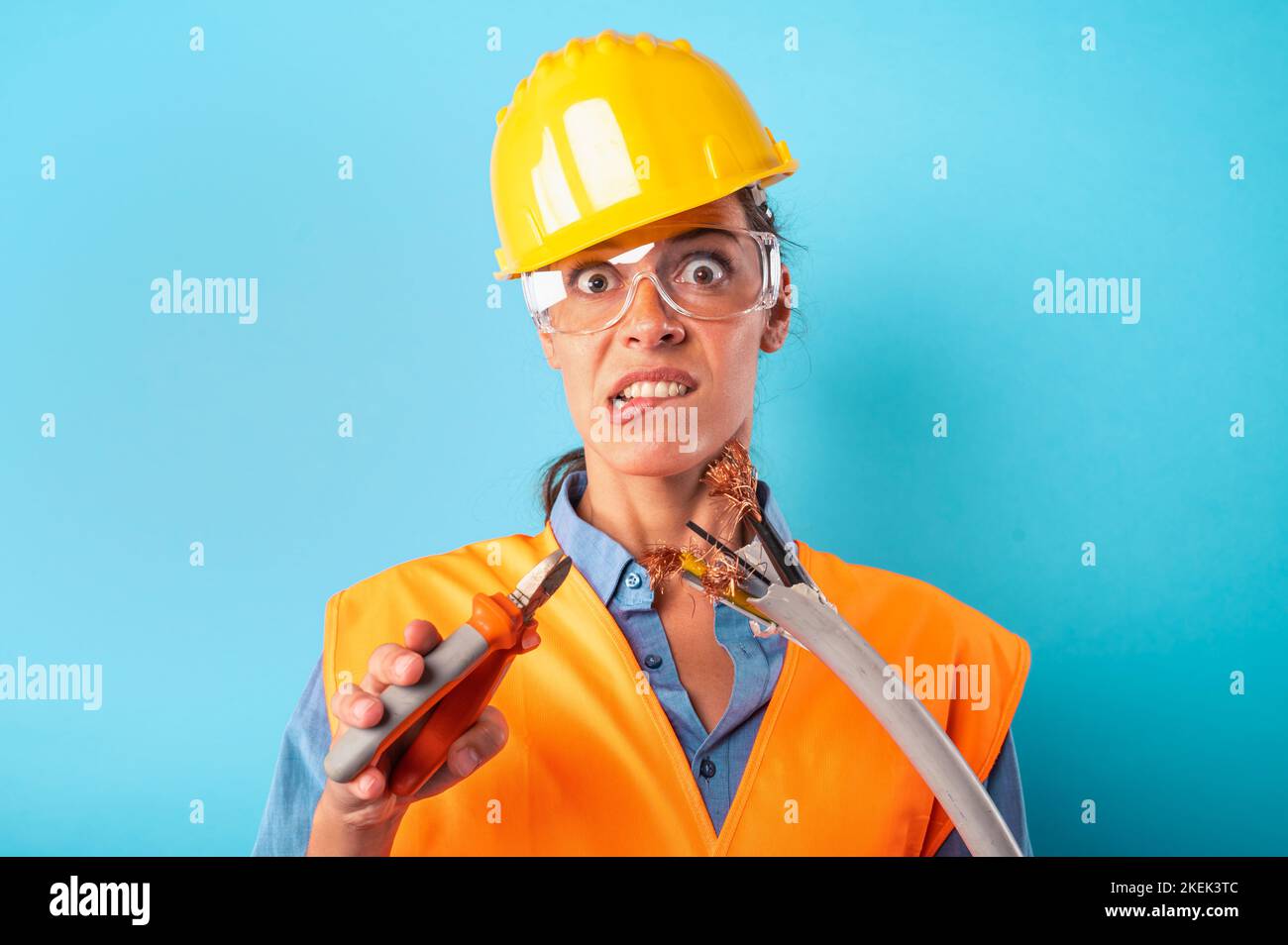 Woman is pensive about her work due to electric shock Stock Photo - Alamy