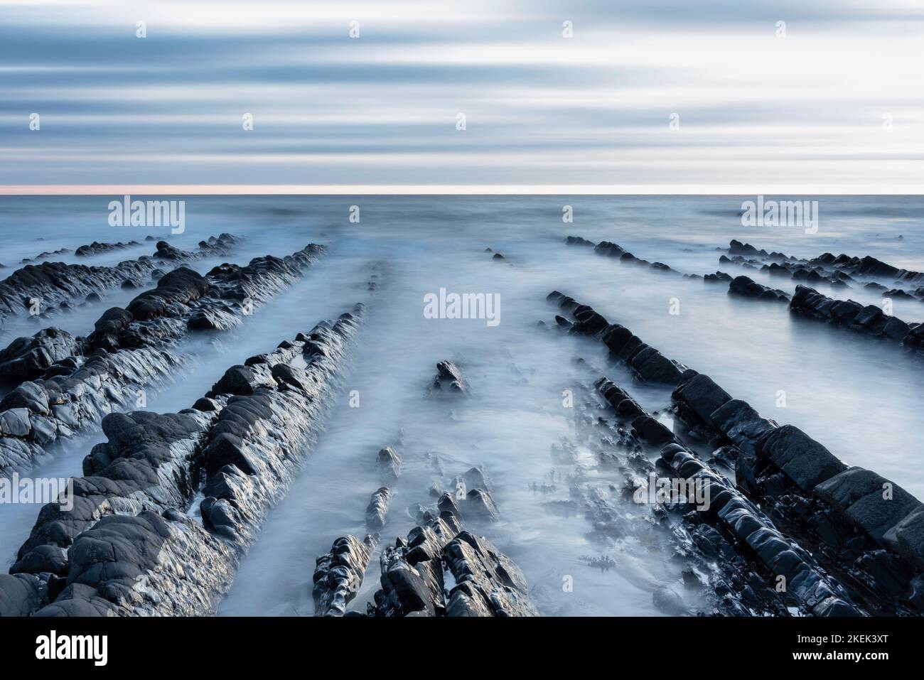 Stunning sunset landscape image of Welcome Mouth Beach in Devon England ...