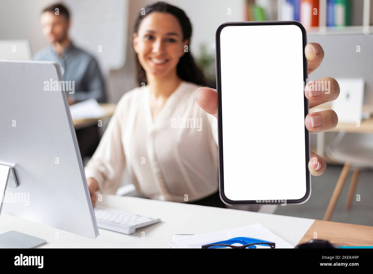 Happy millennial european female manager working at computer, show ...