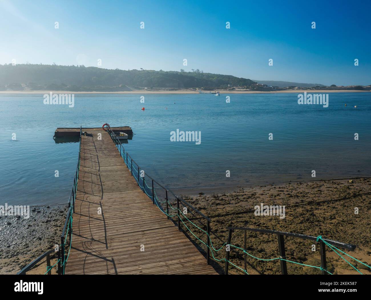 Small wooden boat dock, pier for ferry boats across the river Mira ...