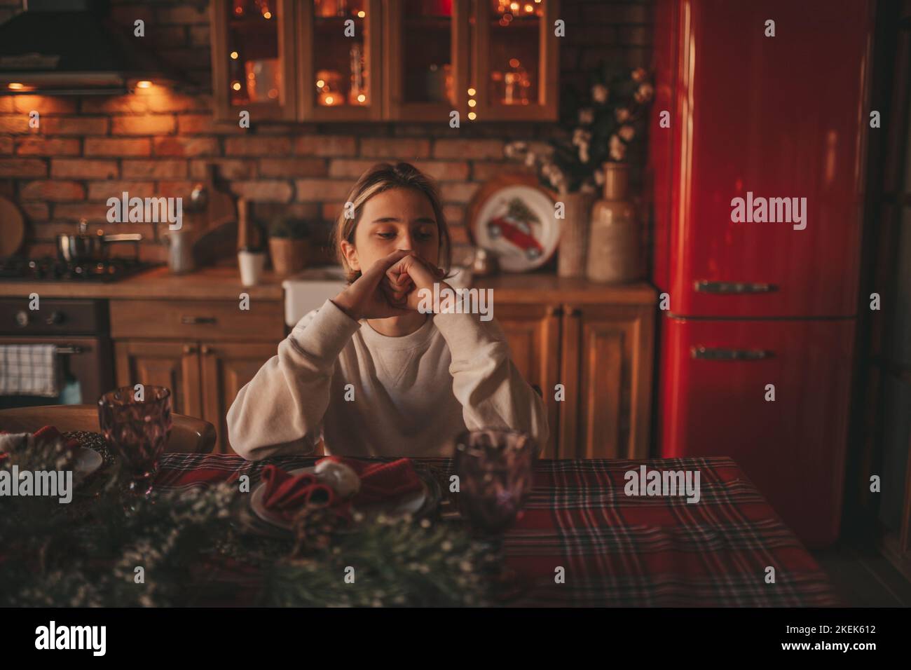 Young teen boy with long hair thoughtful look sad eyes negative mood ...