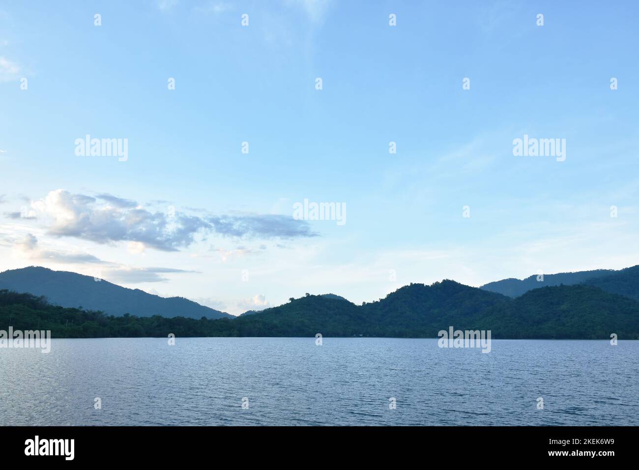 landscape of water reservoir lake with mountain background in sunset ...