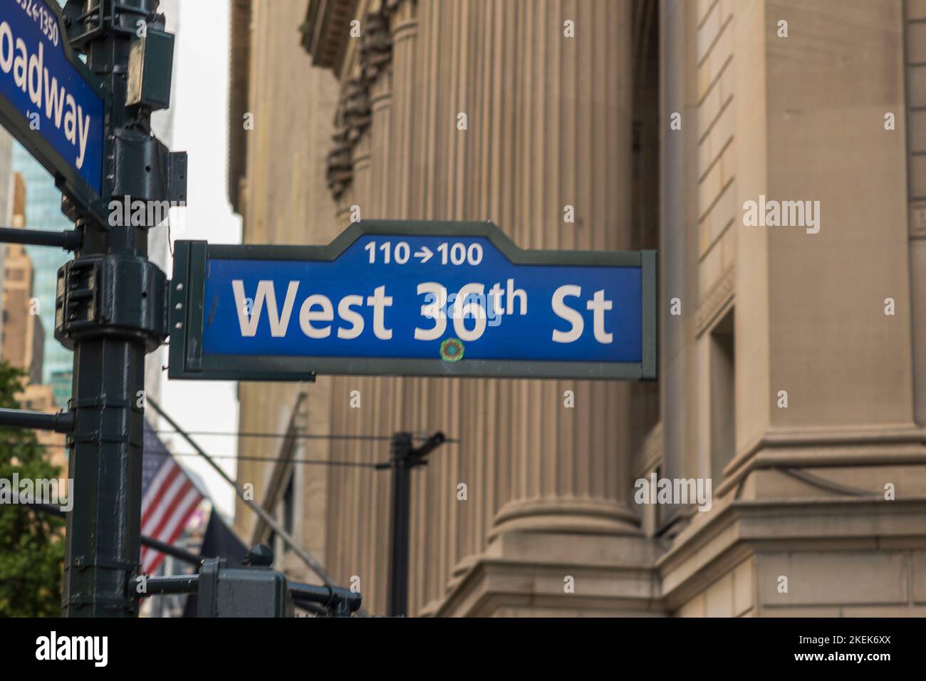 Close up view of blue road sign direction West 36th street and Broadway ...