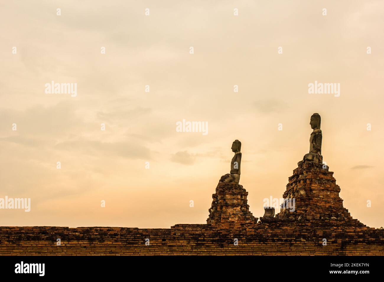 Buddha statue on sunset sky background Stock Photo - Alamy
