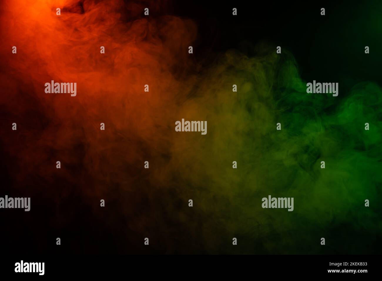 Red yellow green smoke on a black background Stock Photo - Alamy