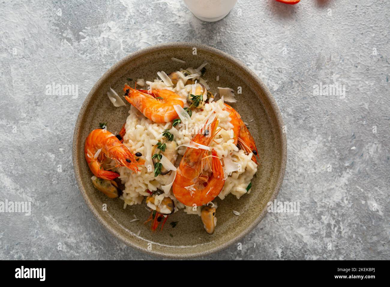 Overhead view of rice risotto with seafood shrimps mussels italian food ...