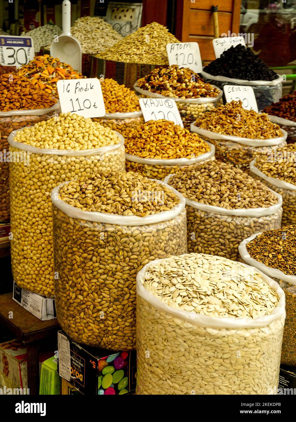 A vertical closeup of traditional dried nuts in display for selling in ...