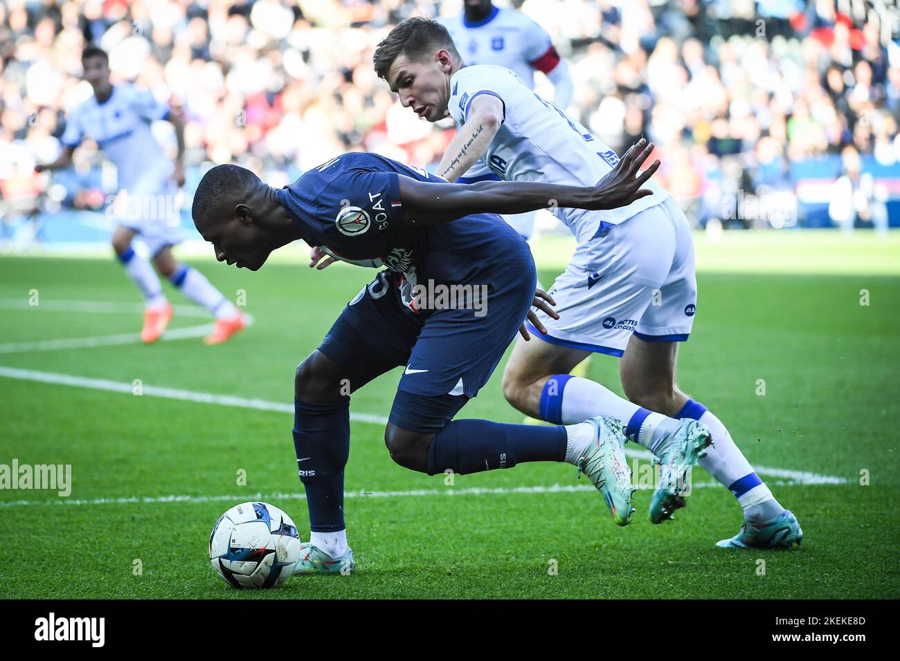 Nuno MENDES of PSG and Paul JOLY of Auxerre during the French ...