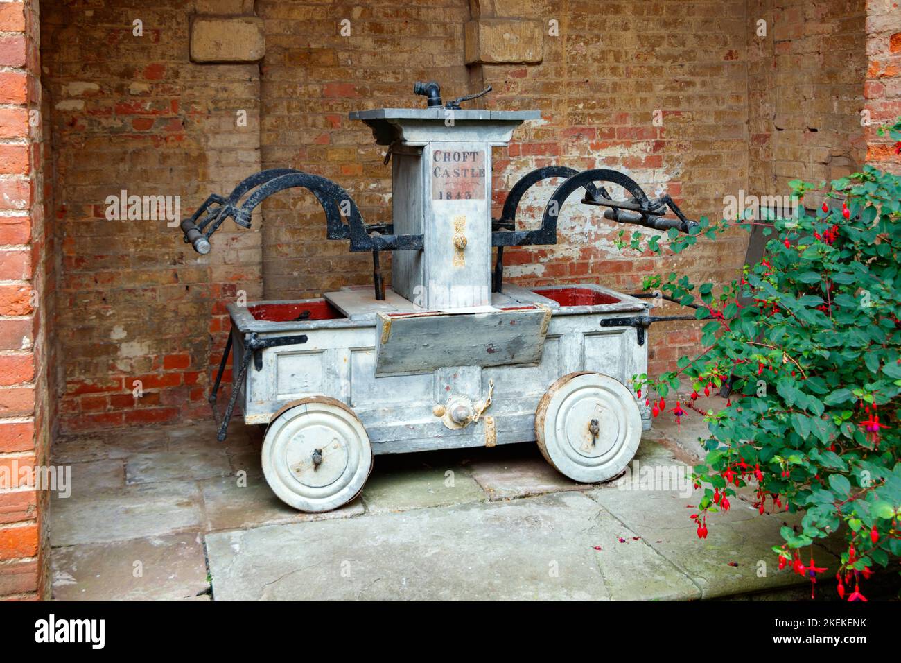 vintage hand fire pump at Croft Castle Herefordshire Stock Photo - Alamy