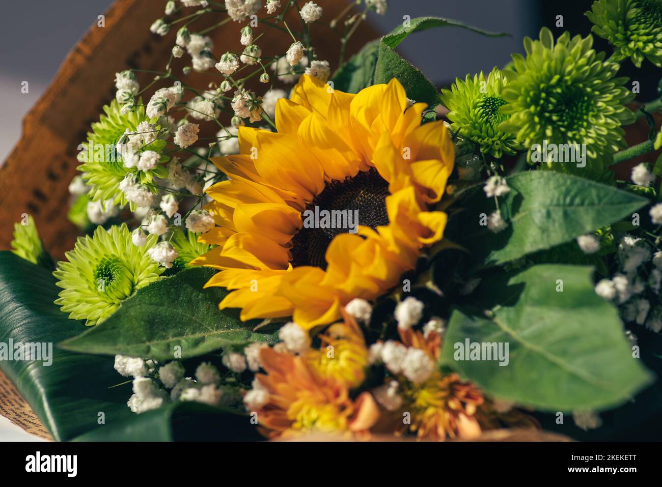 Bouquet of flowers wrapped in paper Stock Photo - Alamy