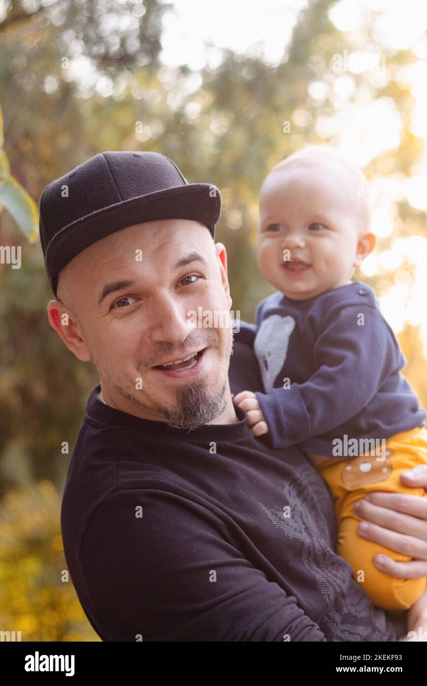 Happy father with his child outdoors Stock Photo - Alamy