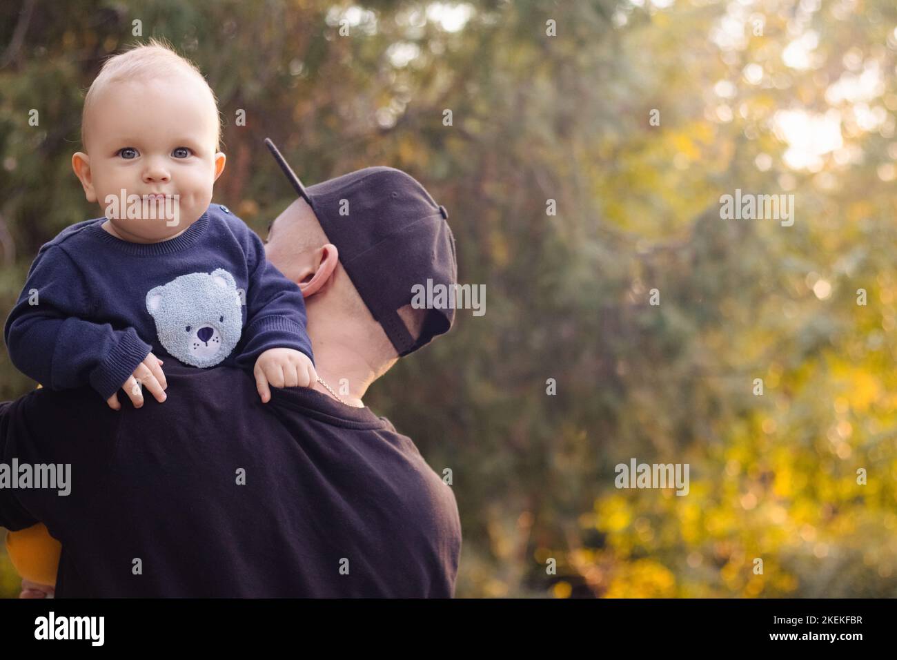 Happy father with his child outdoors Stock Photo - Alamy