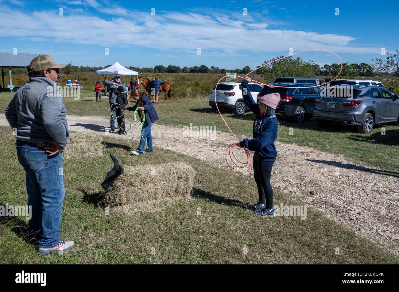 A man teaching kids how to throw a rope in a local park. Houston, Texas ...