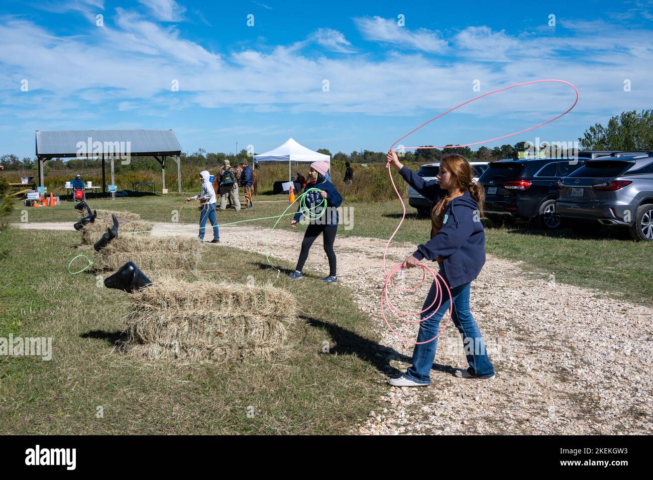 Young girls practicing throwing rope in a local park. Houston, Texas ...