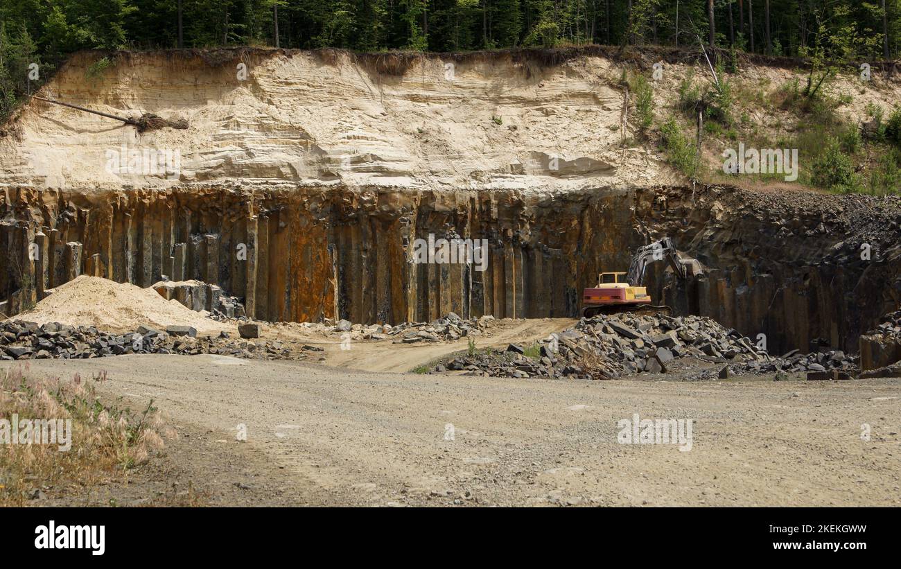 Abandoned basalt quarry. Basalt faceted rocks Stock Photo - Alamy