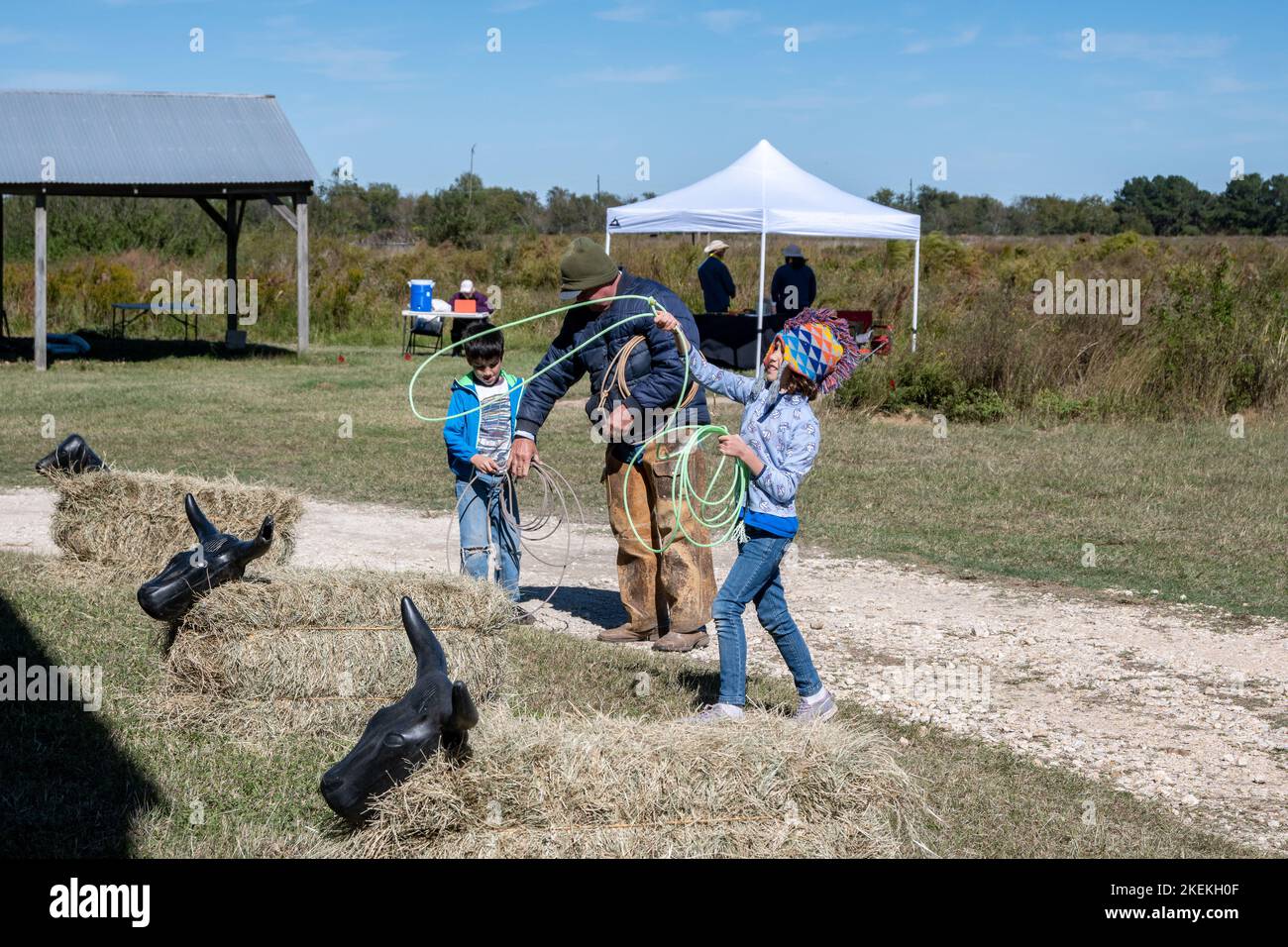 A man teaching kids how to throw a rope in a local park. Houston, Texas ...