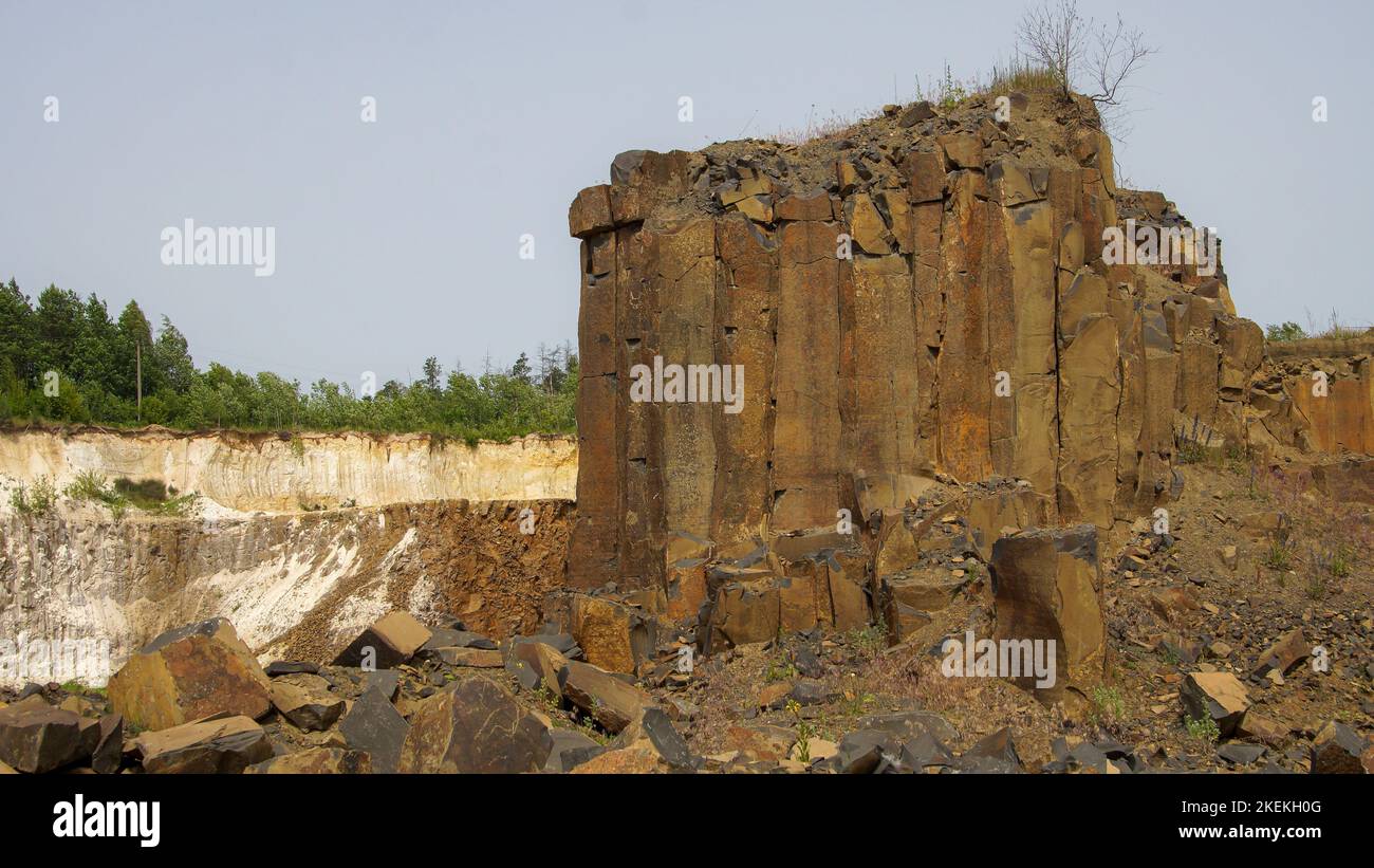 Abandoned basalt quarry. Basalt faceted rocks Stock Photo - Alamy