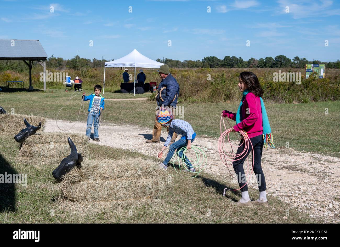A man teaching kids how to throw a rope in a local park. Houston, Texas ...
