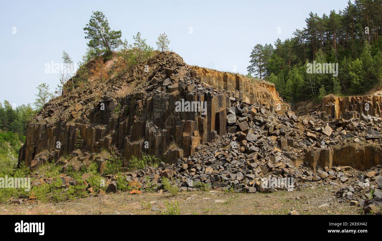 Abandoned basalt quarry. Basalt faceted rocks Stock Photo - Alamy