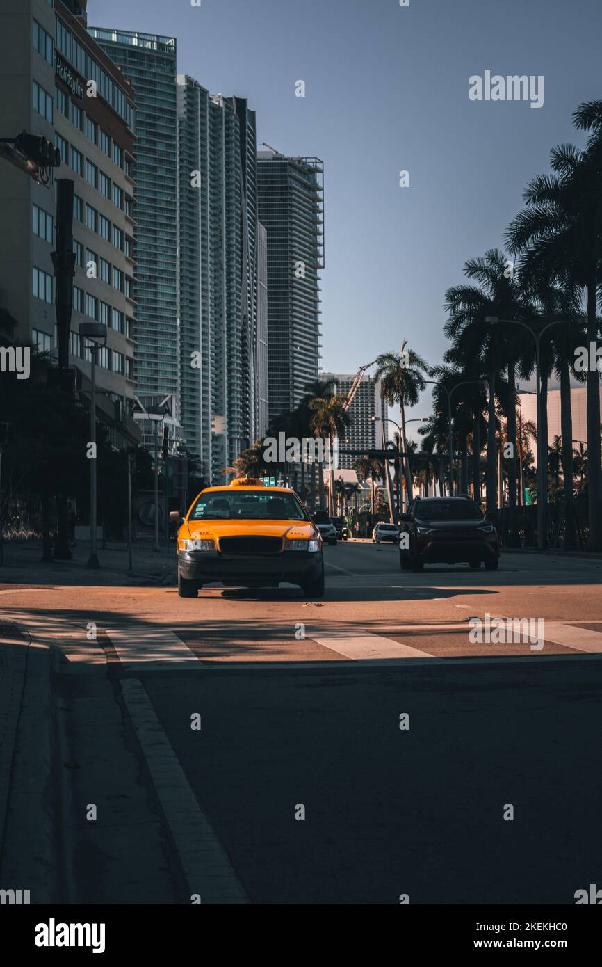 A vertical shot of a yellow taxi in the street of Miami city Stock ...