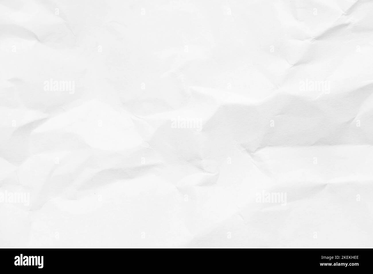 Grunge wrinkled white color paper textured background with copy space ...