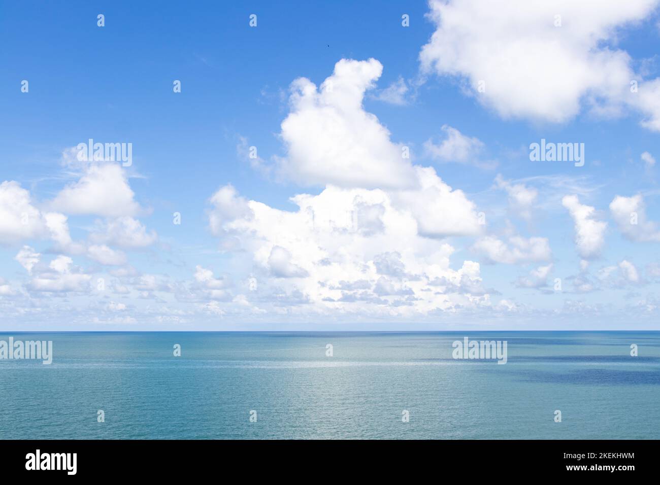 Beautiful calm turquoise color sea and blue sky with white color cloud ...