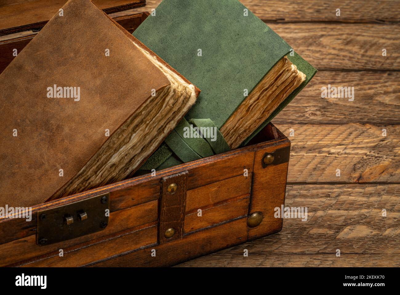 old books or journals in a retro decorative case on wooden rustic table ...