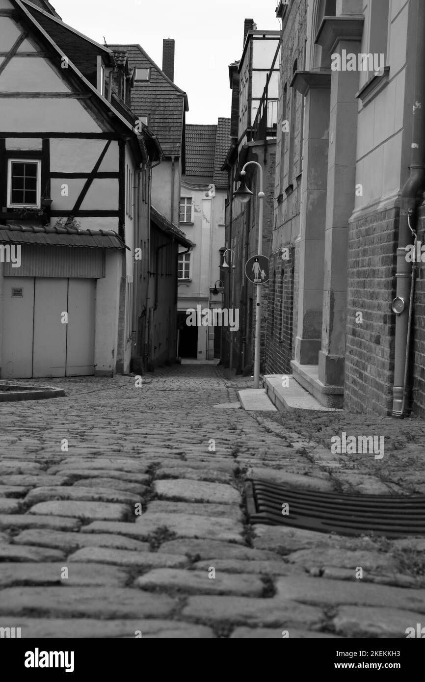 A vertical shot of a pavement street in an old village Stock Photo - Alamy