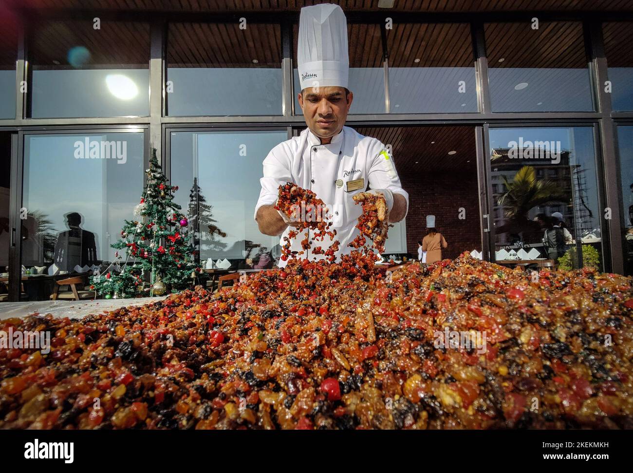 Kathmandu, Bagmati, Nepal. 13th Nov, 2022. A chef mixes dry fruits ...