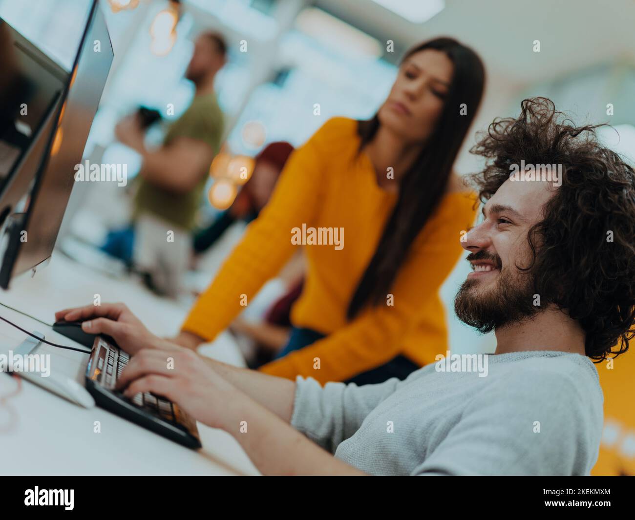 Group of multi-ethnic colleagues working on desktop computers, laptop ...