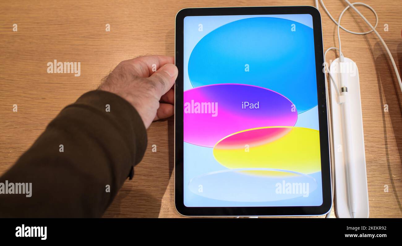Paris, France - Oct 28, 2022: Male hand close-up of new Apple Computers ...
