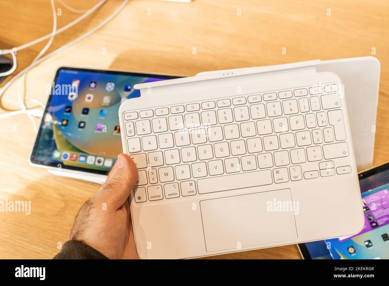 Paris, France - Oct 28, 2022: Man using new Apple Computers keyboard ...