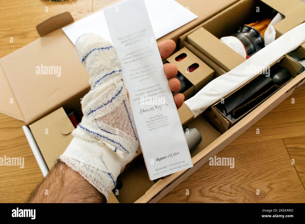 Paris, France - Jul 4, 2022: Man hand holding during unboxing quick ...