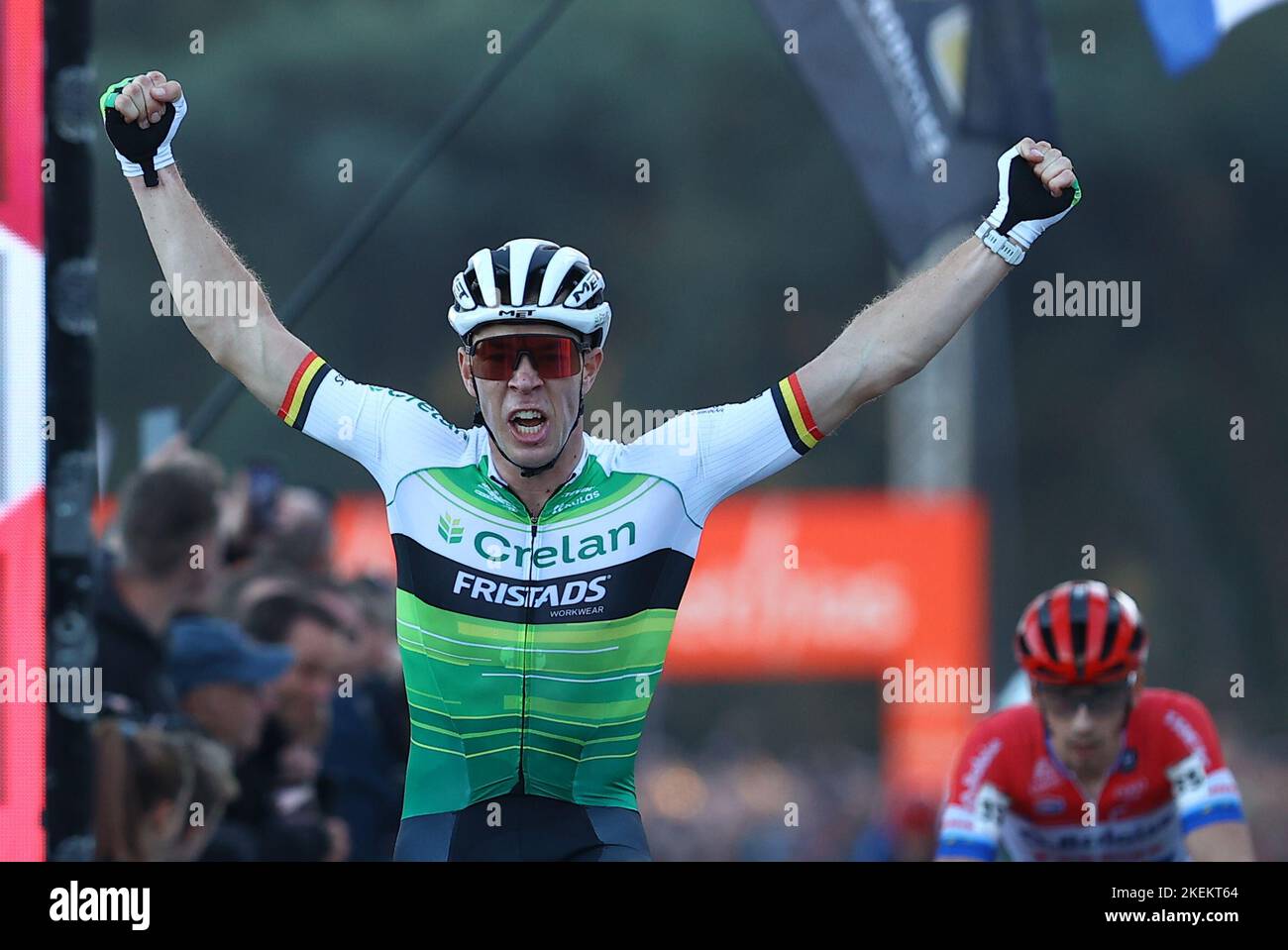 Belgian Laurens Sweeck celebrates as he crosses the finish line to win ...