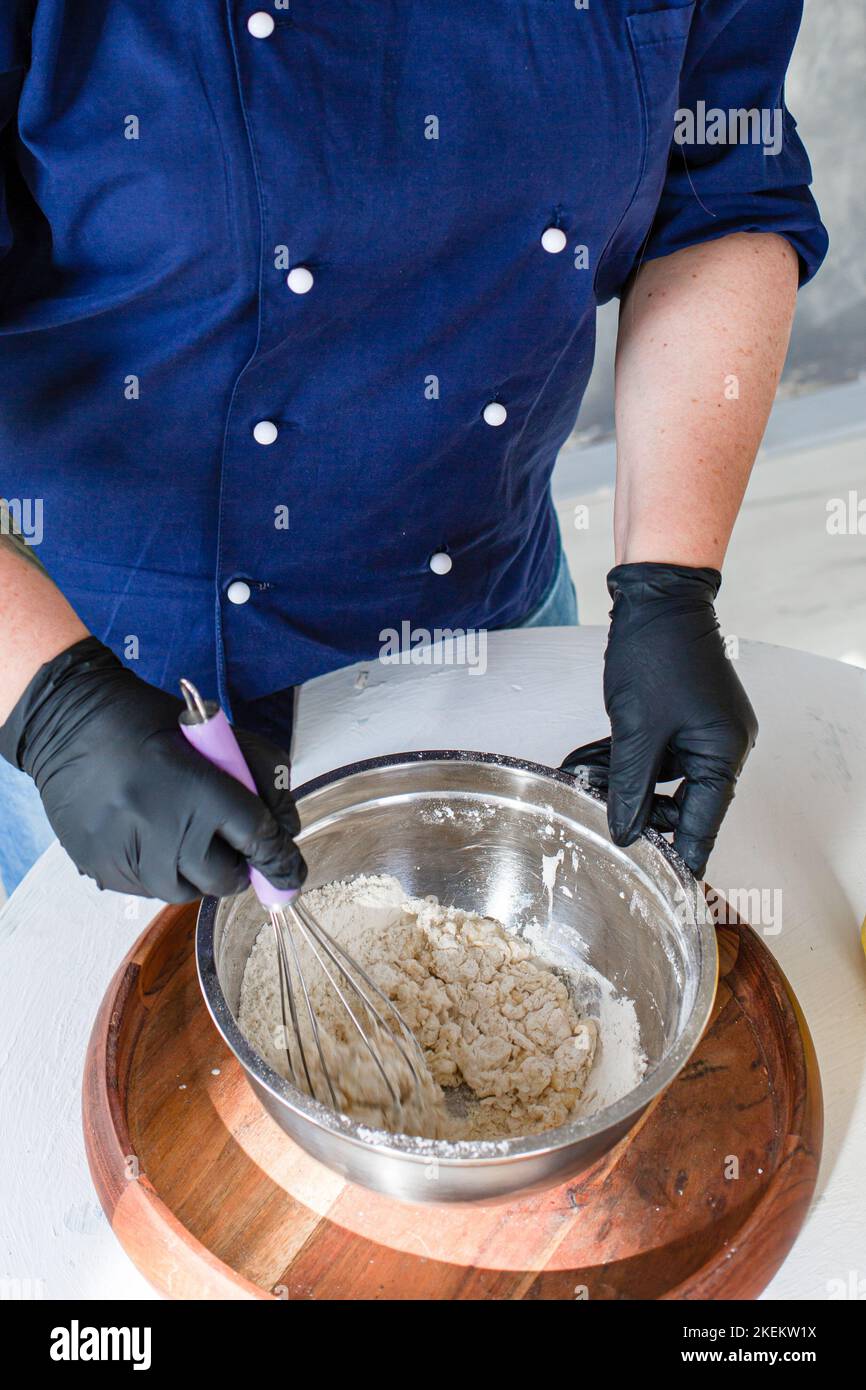 Woman sifting flour through hi-res stock photography and images - Alamy