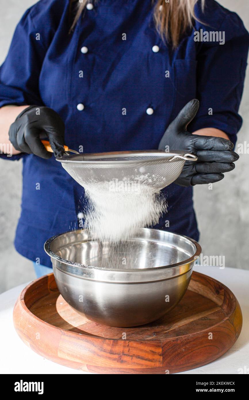 Process sifting flour hands hi-res stock photography and images - Alamy