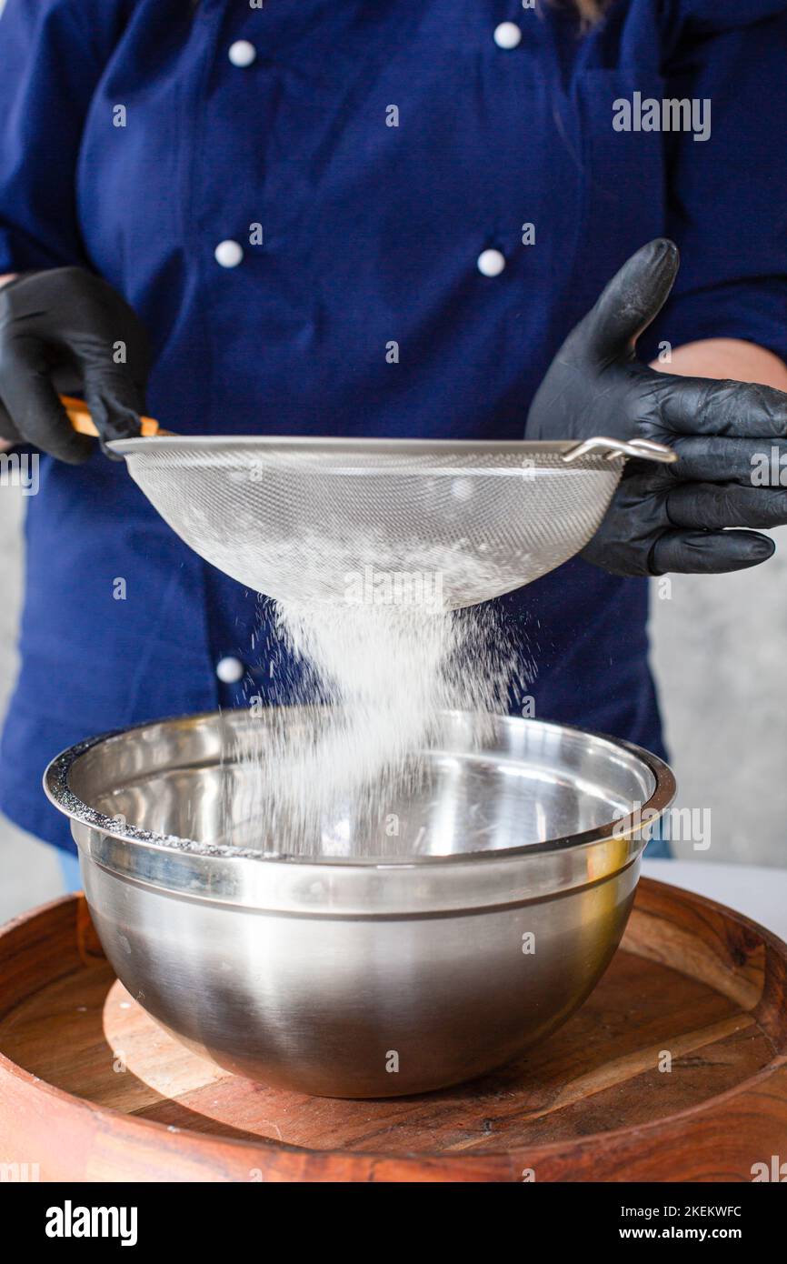 Sifting flour through sieve on hi-res stock photography and images - Alamy