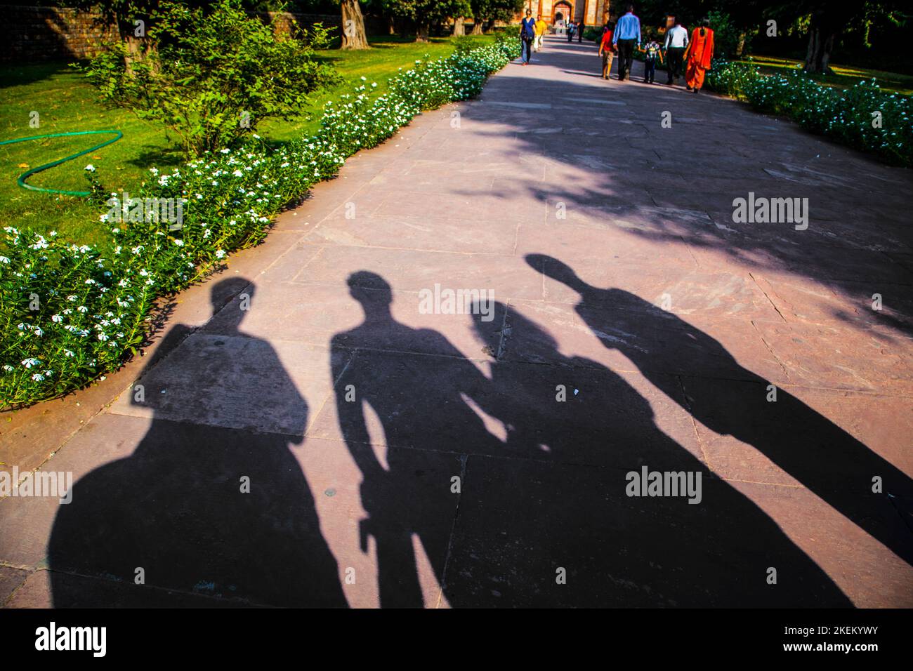 Delhi, India - October 15, 2012: shadows of family visiting a landmark ...