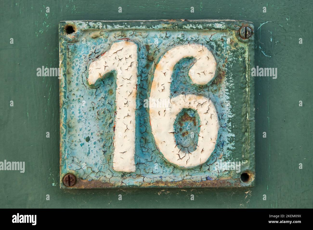 Old retro weathered cast iron plate with number 16 closeup Stock Photo ...