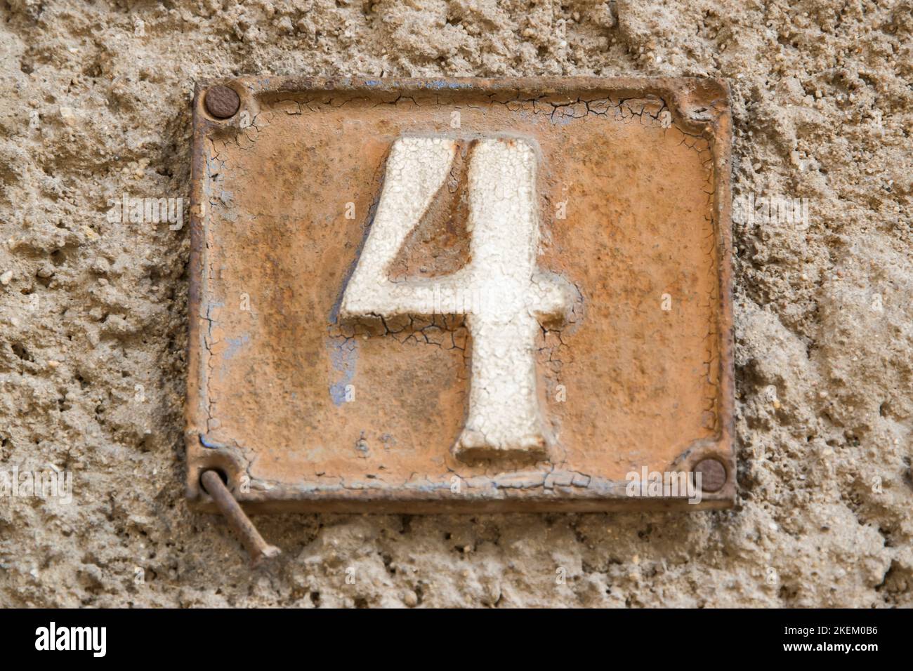 Old retro weathered cast iron plate with number 4 closeup Stock Photo ...