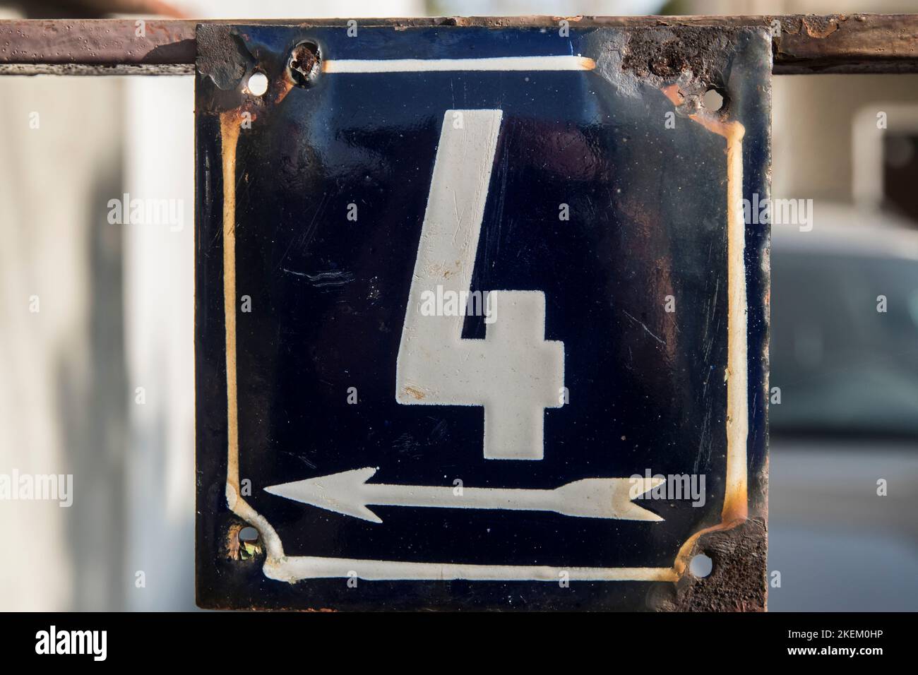 Weathered grunge square metal enameled plate of number of street ...