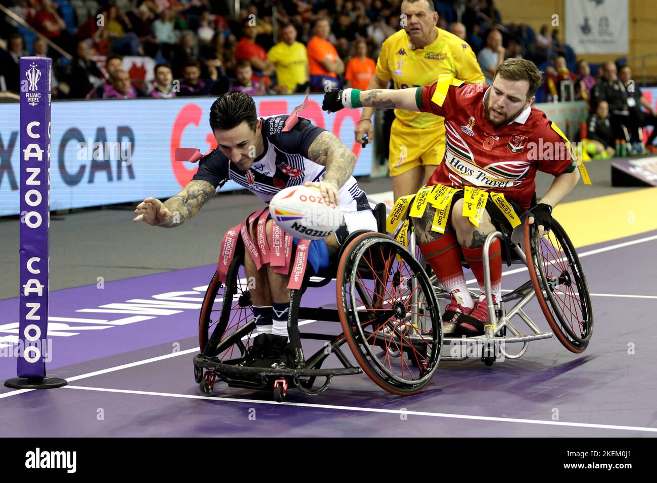 England's Lewis King (left) scores a try during the Wheelchair Rugby ...